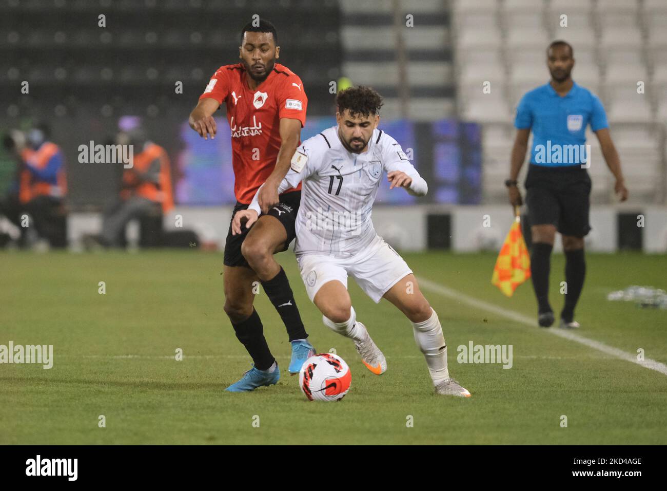Hazem Shehata (17) of Al Wakrah on the ball as Abdulaziz Hatem (11) of Al Rayyan closes in ...