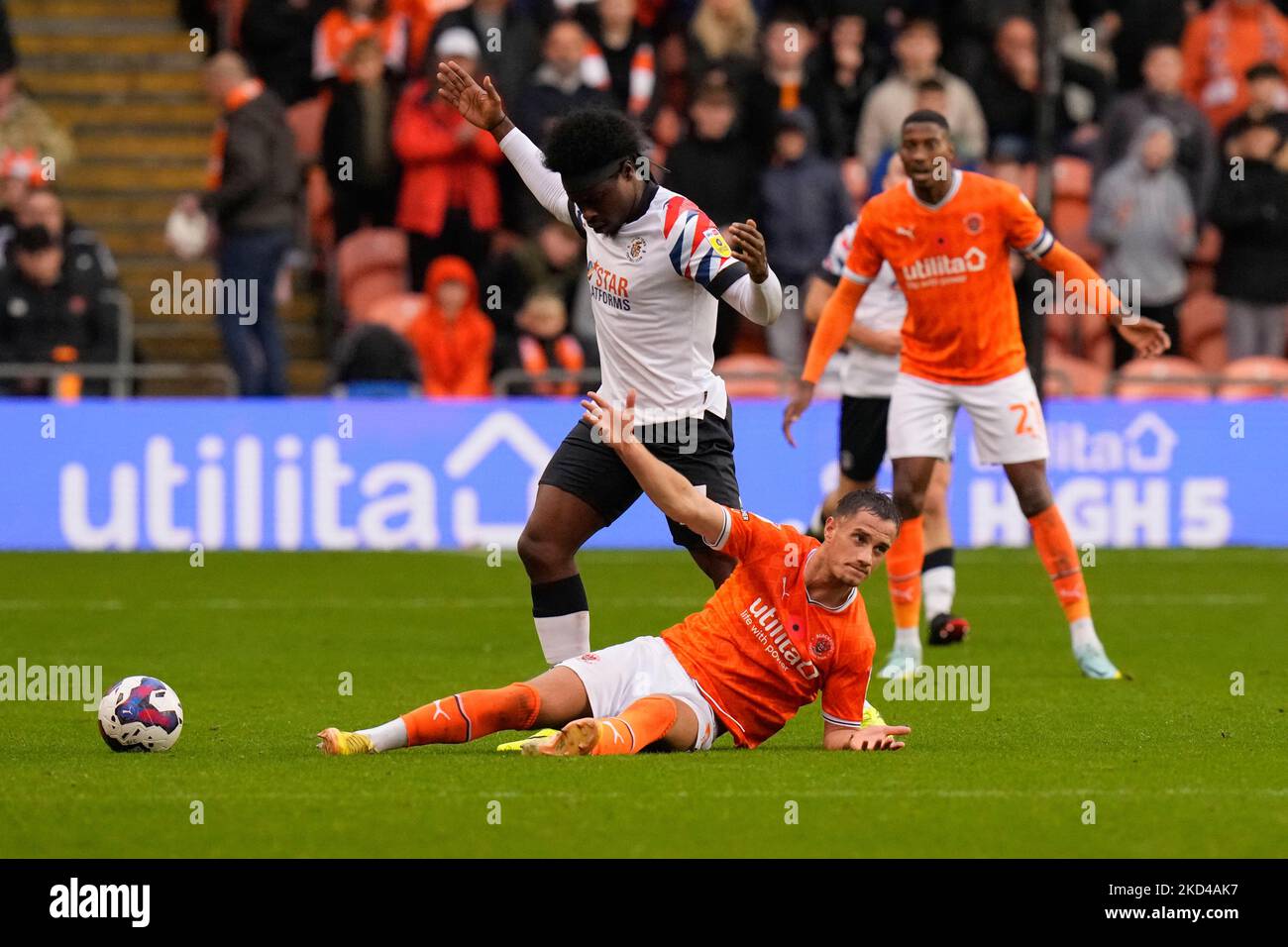 Pelly Ruddock Mpanzu #17 of Luton Town fouls Jerry Yates #9 of ...