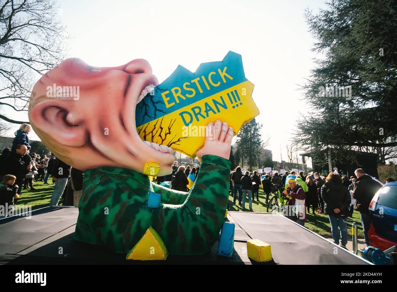 a carnival float depicting Russian president Vladimir Putin swallow the ...