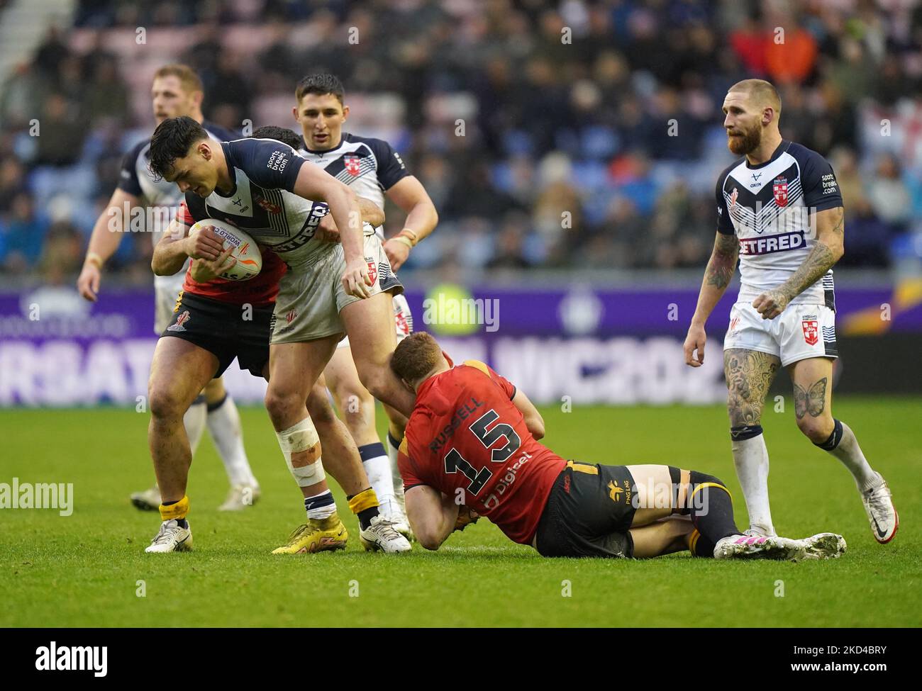England's Herbie Farnworth (left) is tackled by Papua New Guinea's Dan ...