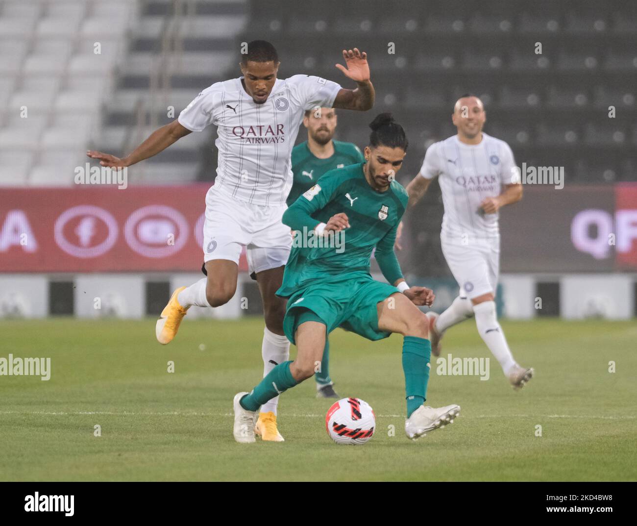 Pedro Miguel (2) of Al Sadd challenges Mohamad Abdulnaser Alabbasi (8 ...
