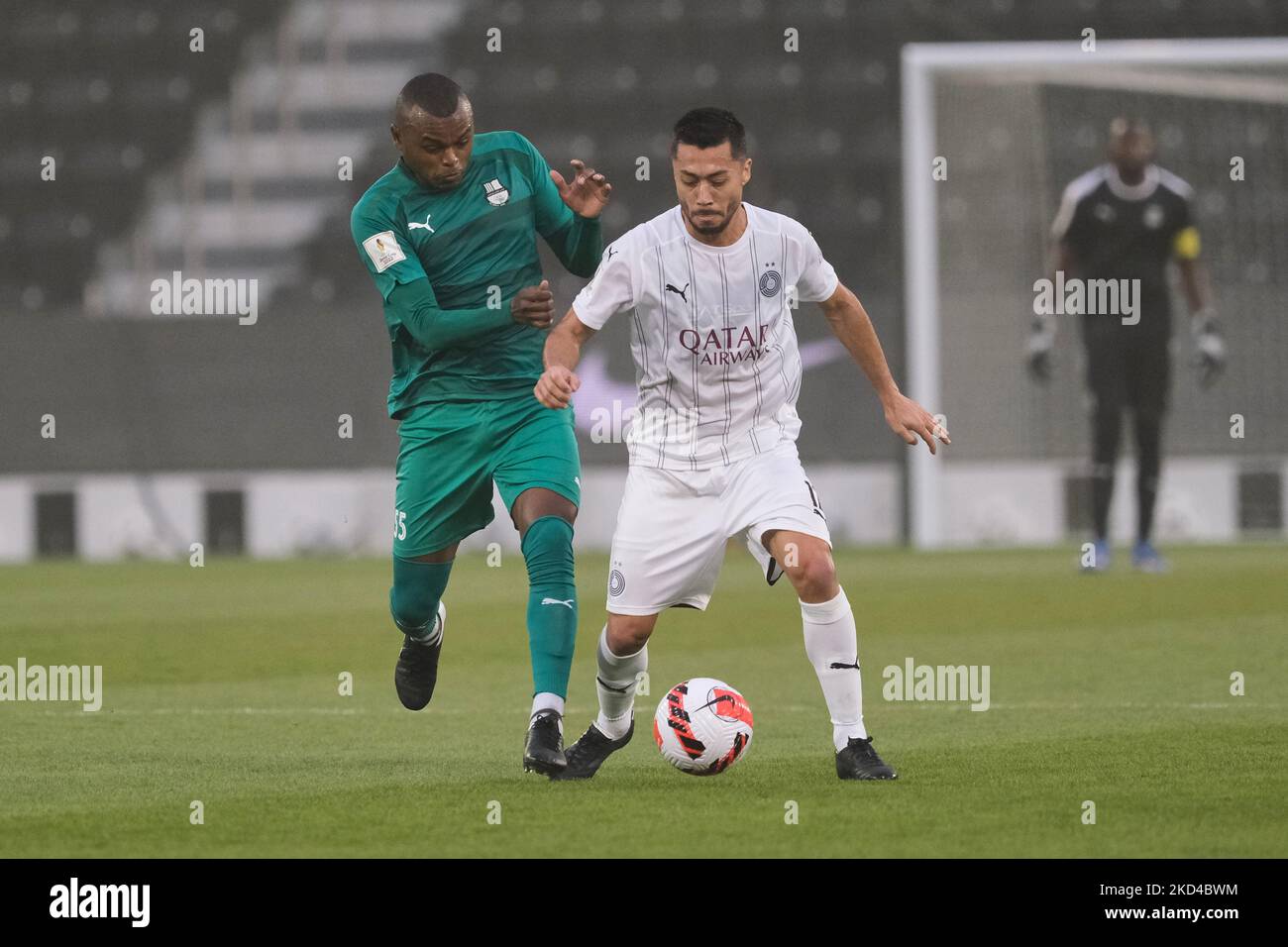 Rodrigo Tabata (12) of Al Sadd on the ball as Sandro Manoel (55) of Al ...