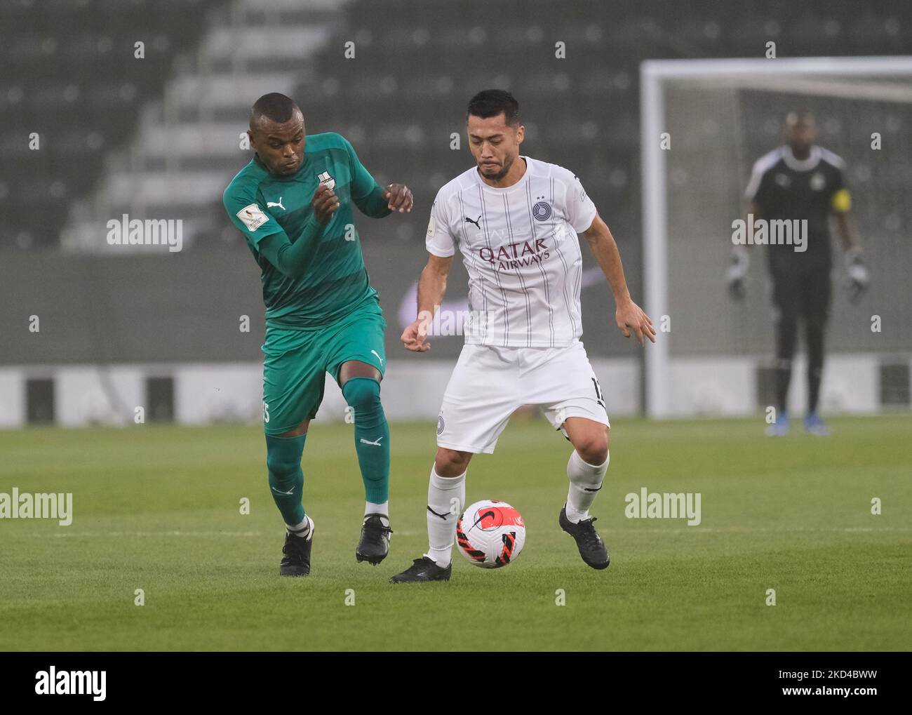 Rodrigo Tabata (12) of Al Sadd on the ball as Sandro Manoel (55) of Al ...