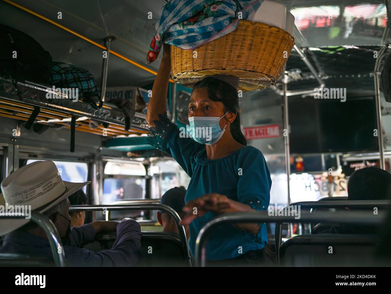 A food and snacks vendor inside a Chicken bus at the bus terminal in ...