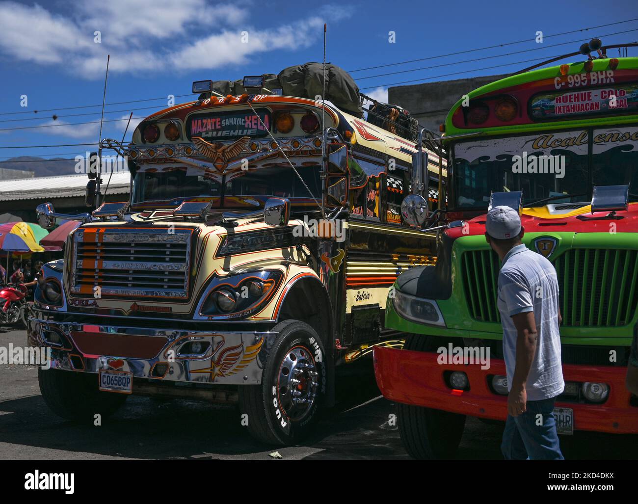 Chicken buses at the bus terminal in the city of Huehuetenango. On ...