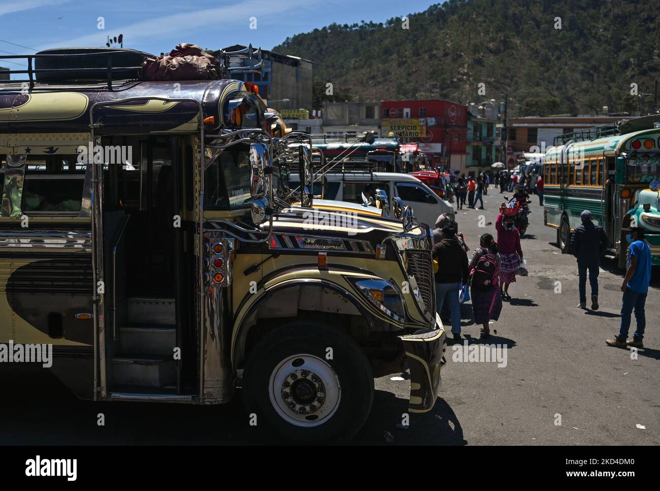 Chicken buses at the bus terminal in the city of Huehuetenango. On ...