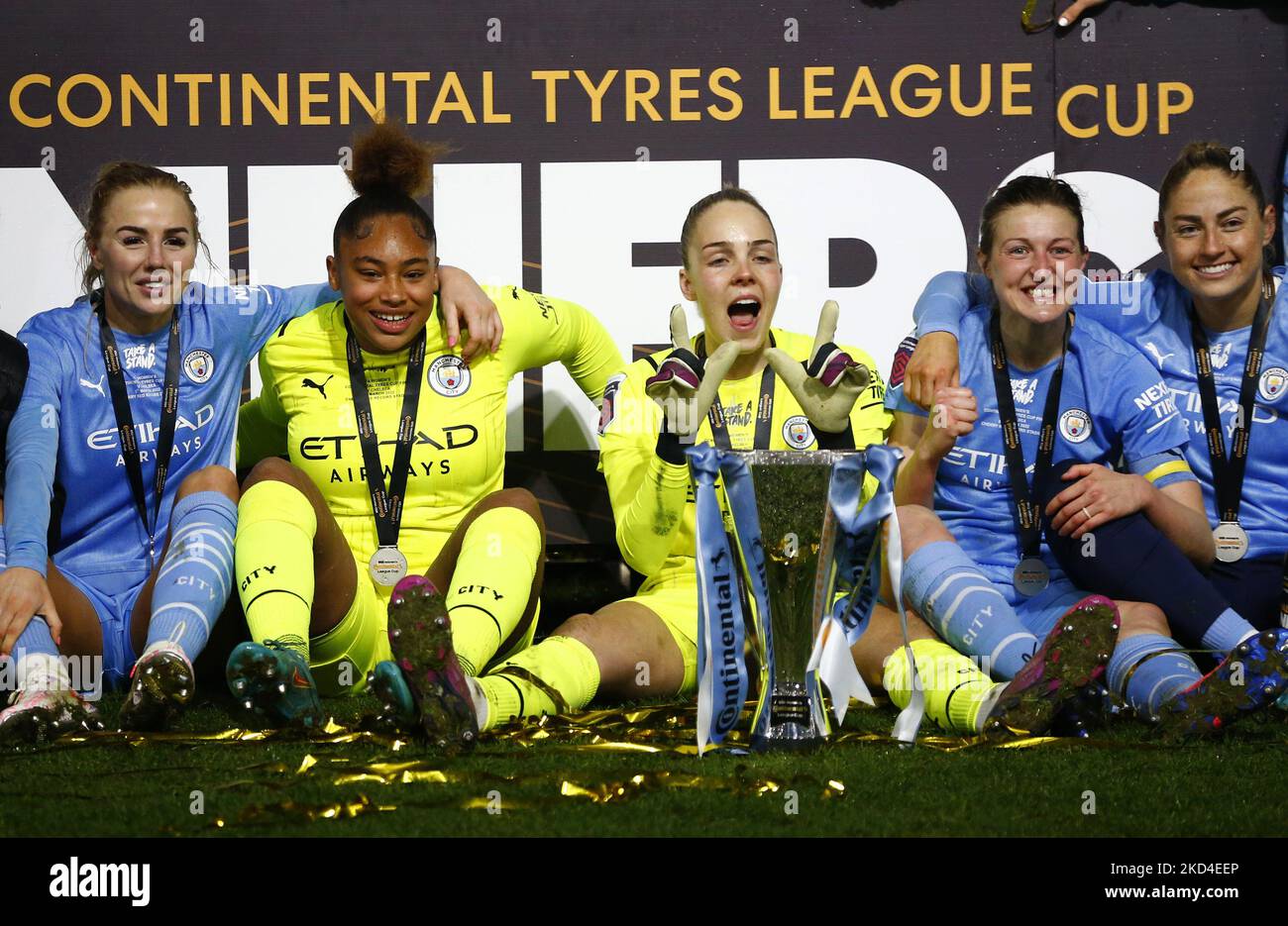 Khiara Keating (Yellow) of Manchester City , Ellie Roebuck with Trophy ...