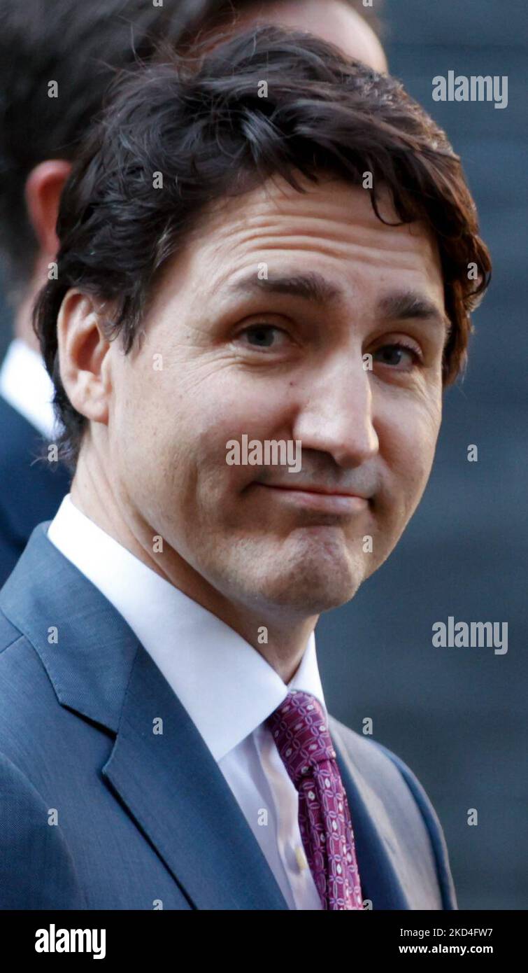 Canadian Prime Minister Justin Trudeau walks along Downing Street in ...