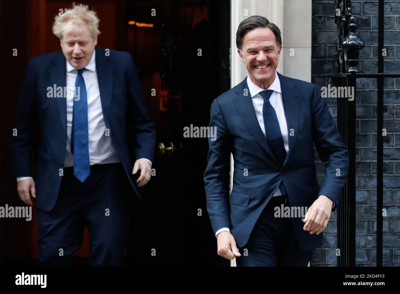 Prime Minister of the Netherlands Mark Rutte (R) reacts as British ...