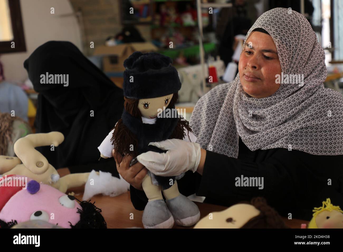 Palestinian women make doll toys at Zeina Association and Cooperative ...