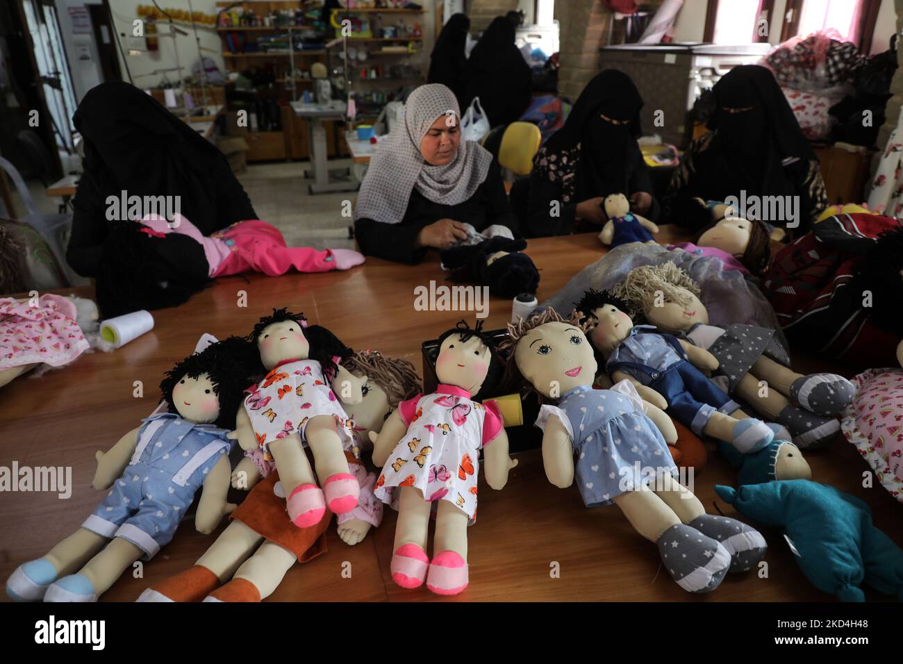Palestinian women make doll toys at Zeina Association and Cooperative ...