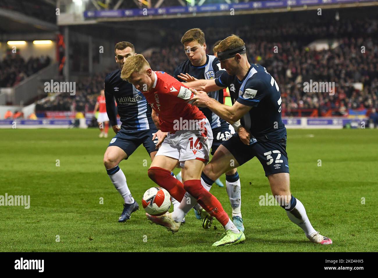 Sam Surrage of Nottingham Forest shields the ball from Tom Lees of ...