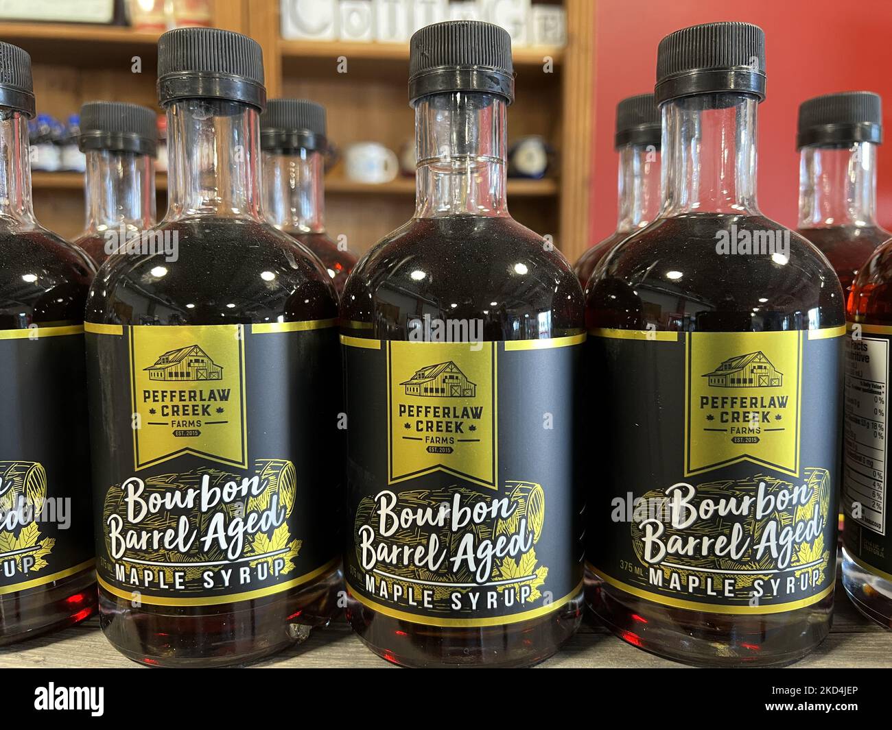 Bottles of bourbon barrel aged maple syrup displayed at a maple syrup ...