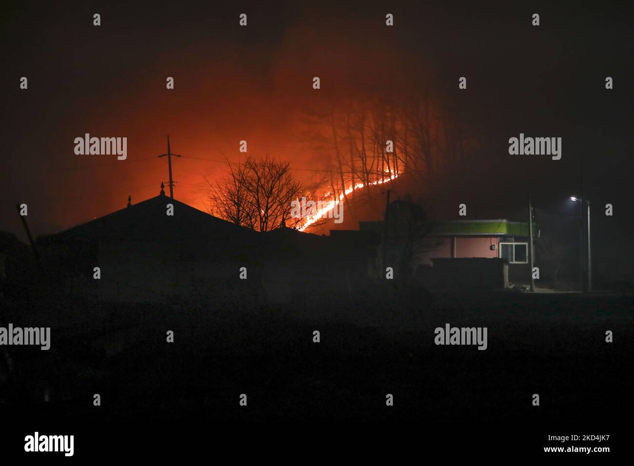 A wildfire burns in the eastern city of Uljin. The fire started in the ...