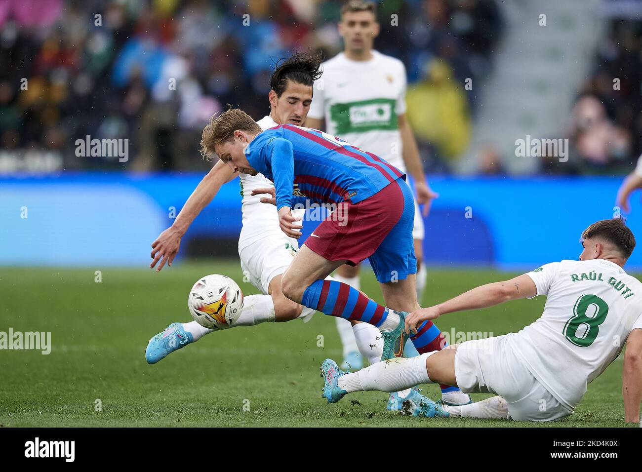 Frenkie de Jong of Barcelona surronded by Elche players during the La ...