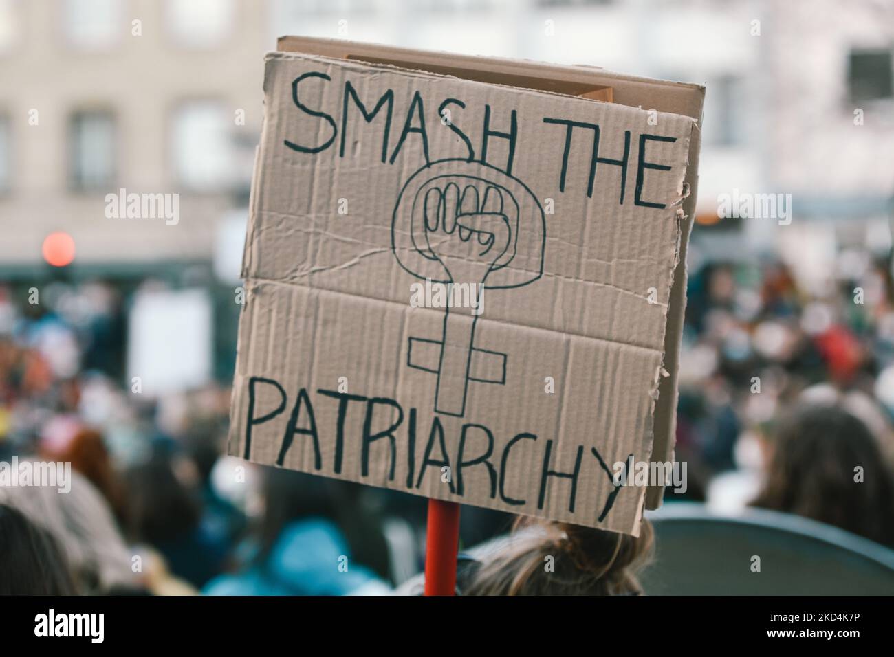 a sign of "smash the patriarchy" is seen during the International women ...