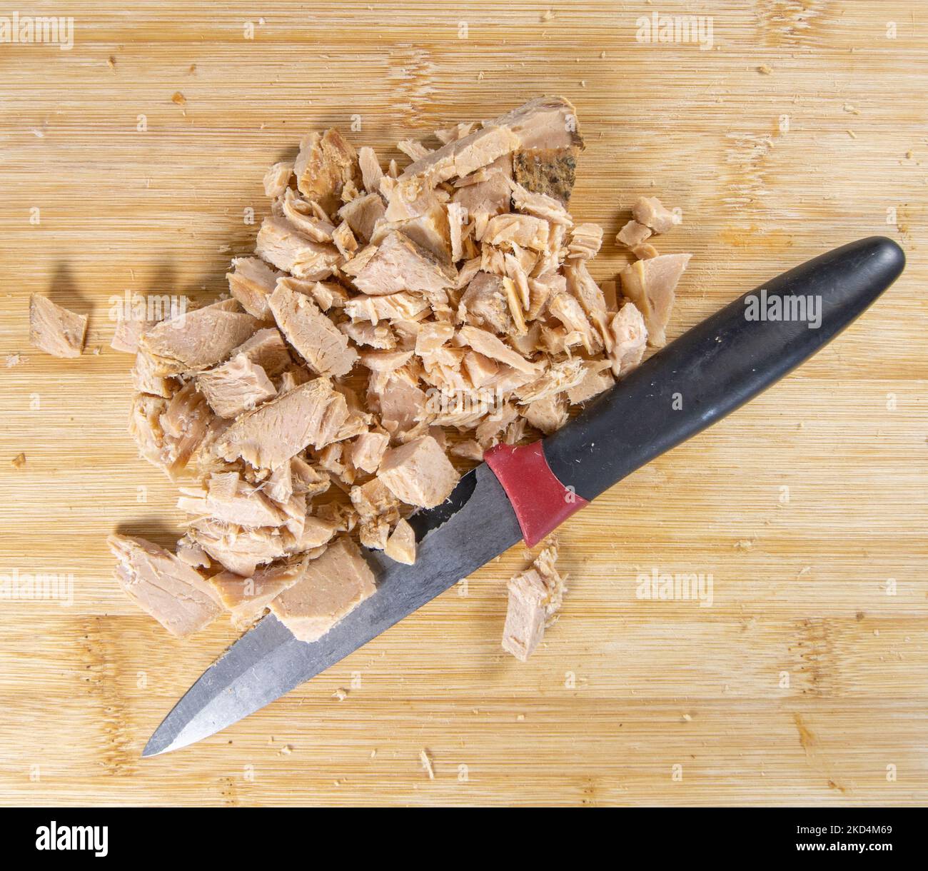 cold roast pork chopped on a wooden board with a sharp knife Stock ...