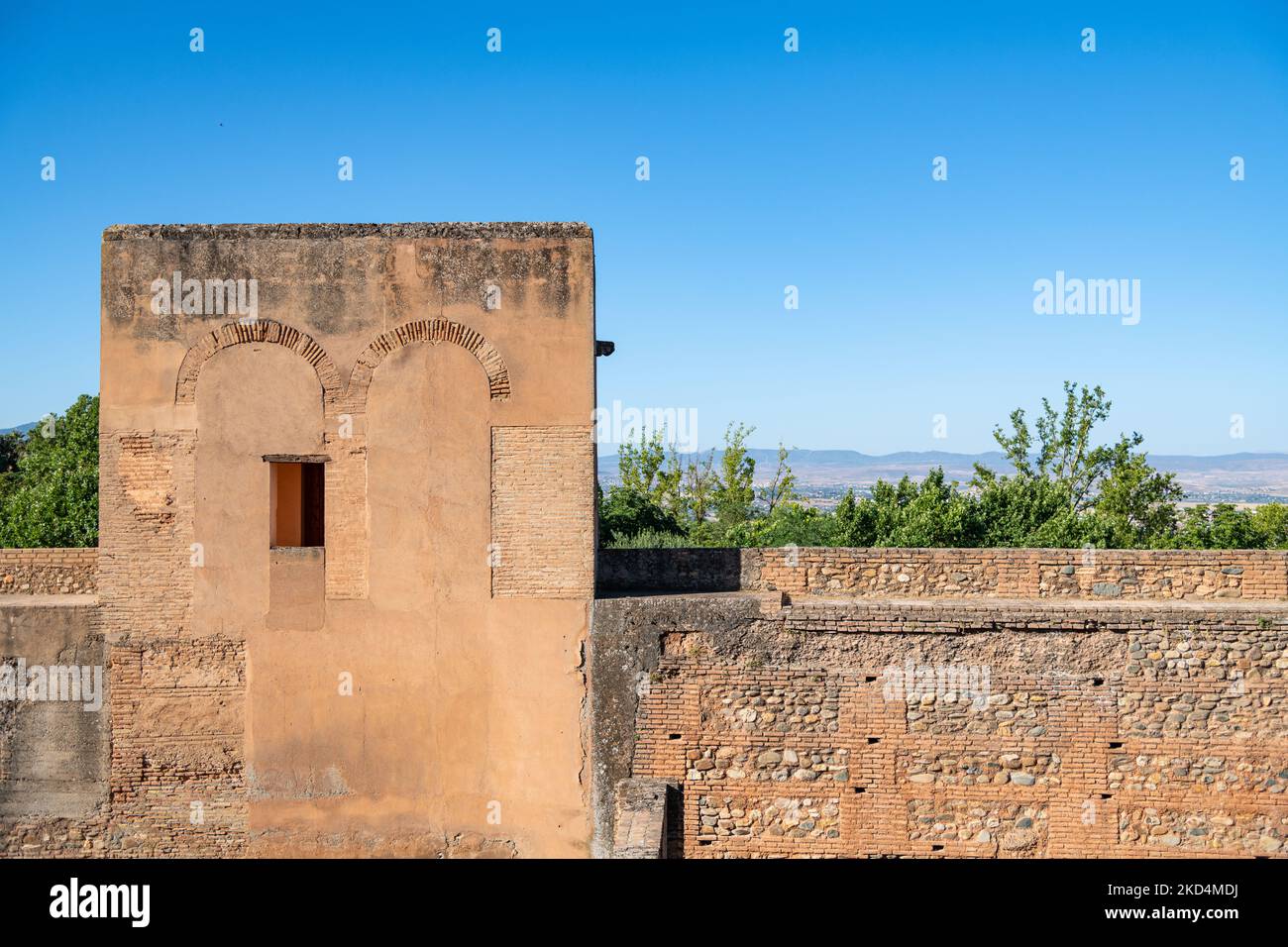 A tower on the outer wall of the Alhambra Palace complex in Granada ...
