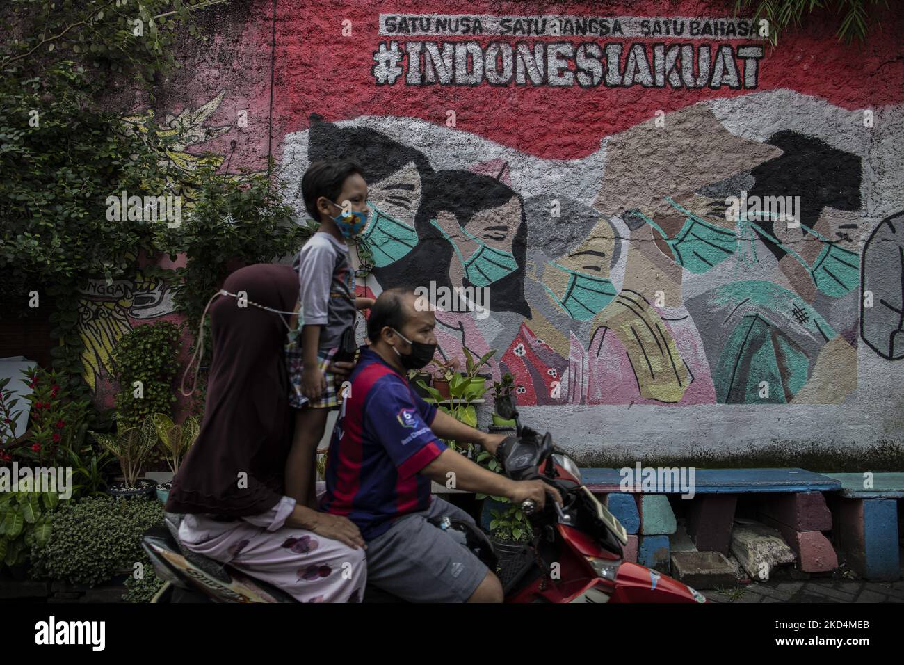 COVID-19 mural at Cirendeu, South Tangerang, Indonesia, on March 9, 2022. (Photo by Donal Husni ...