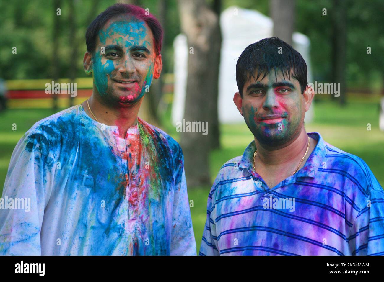 Two South Asian men pose to show off their colours during the Hindu ...