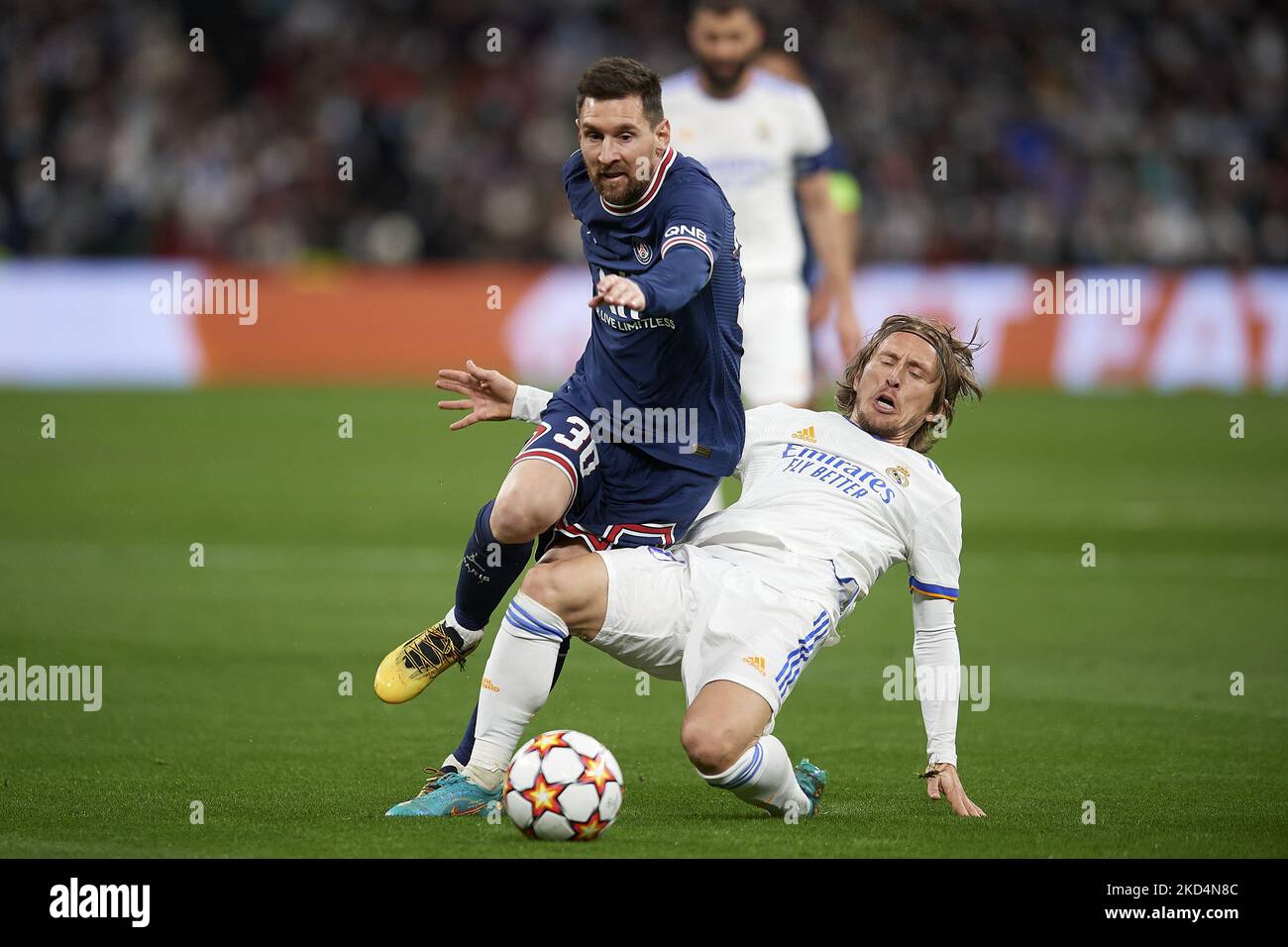 Leo Messi of PSG and Luka Modric of Real Madrid compete for the ball ...