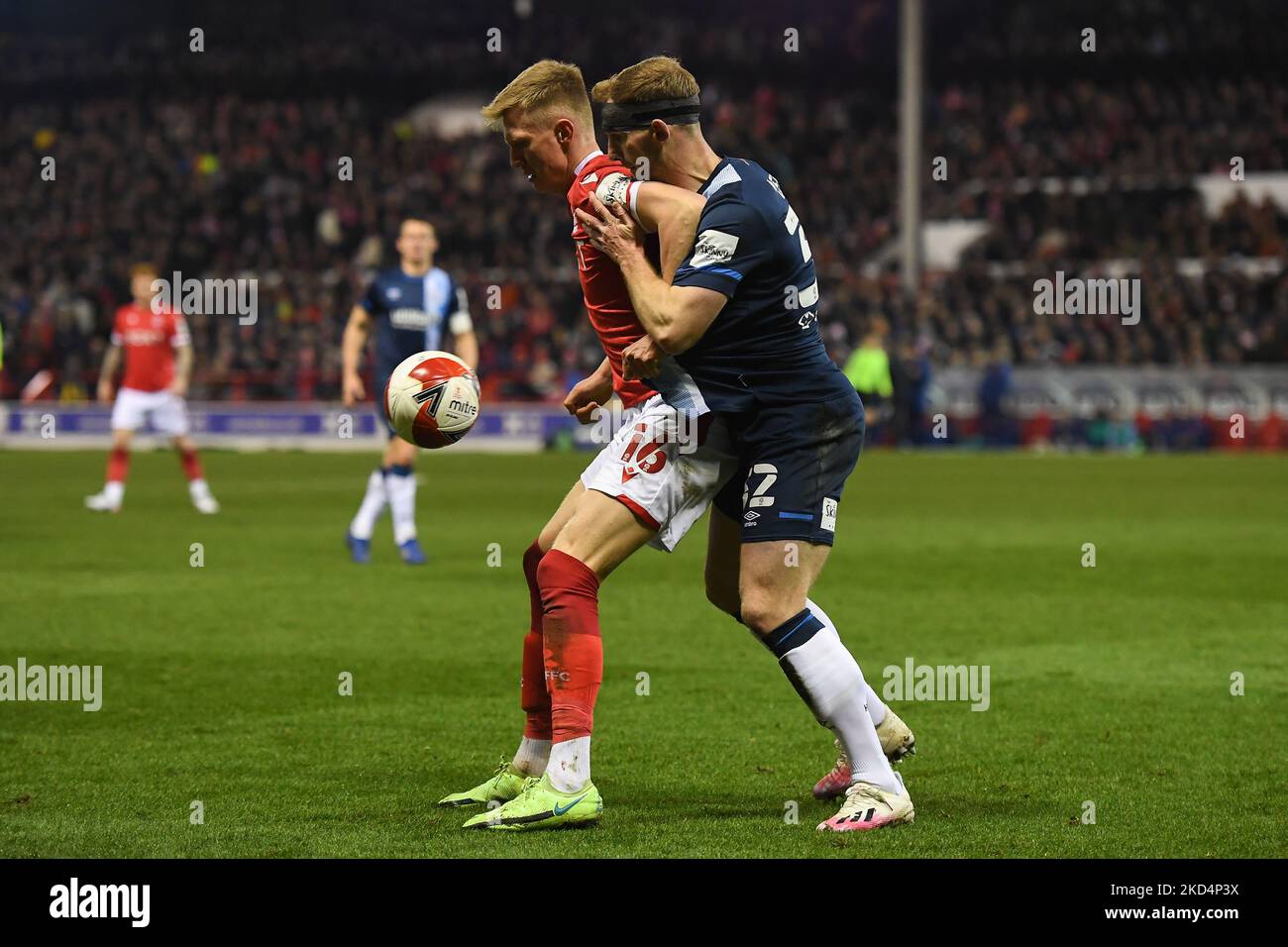 Sam Surrage of Nottingham Forest shields the ball from Tom Lees of ...
