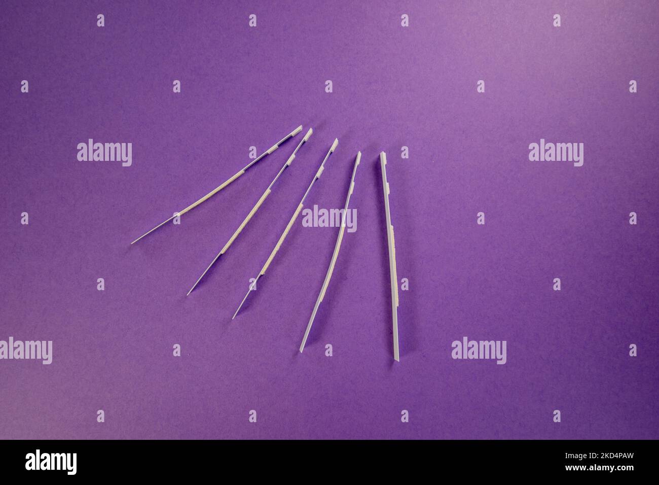 five phosphate test strips isolated on a purple background Stock Photo ...