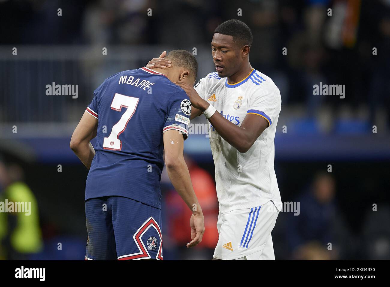 David Alaba of Real Madrid consoles Kylian Mbappe of PSG after losing ...