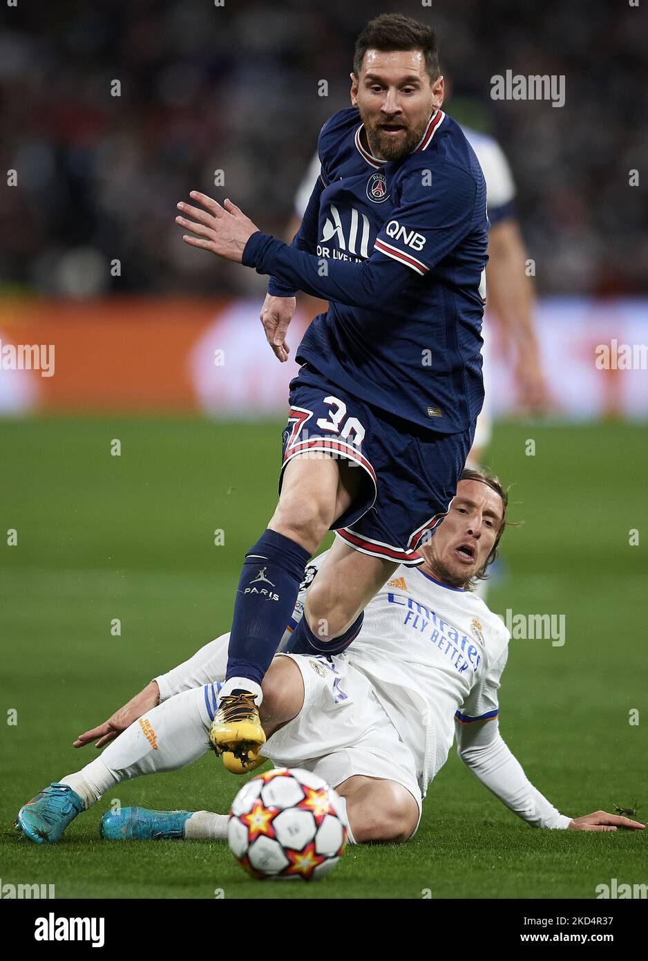 Leo Messi of PSG and Luka Modric of Real Madrid compete for the ball ...