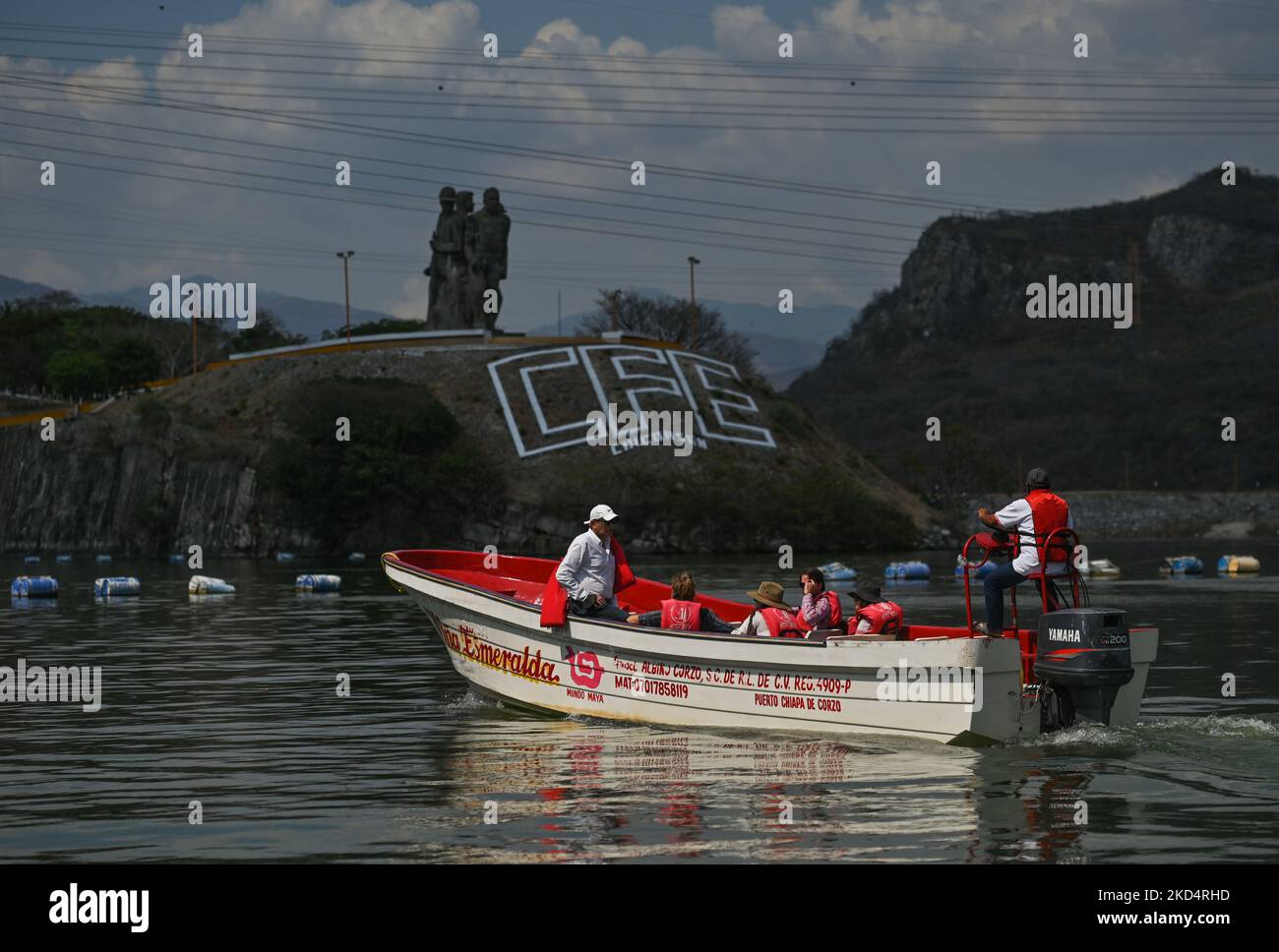 A boat with visitors seen near the statue to the Workers at the ...