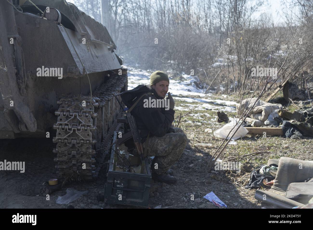 Ukrainian soldiers inspect a Russian armored vehicle nearby Brovary ...