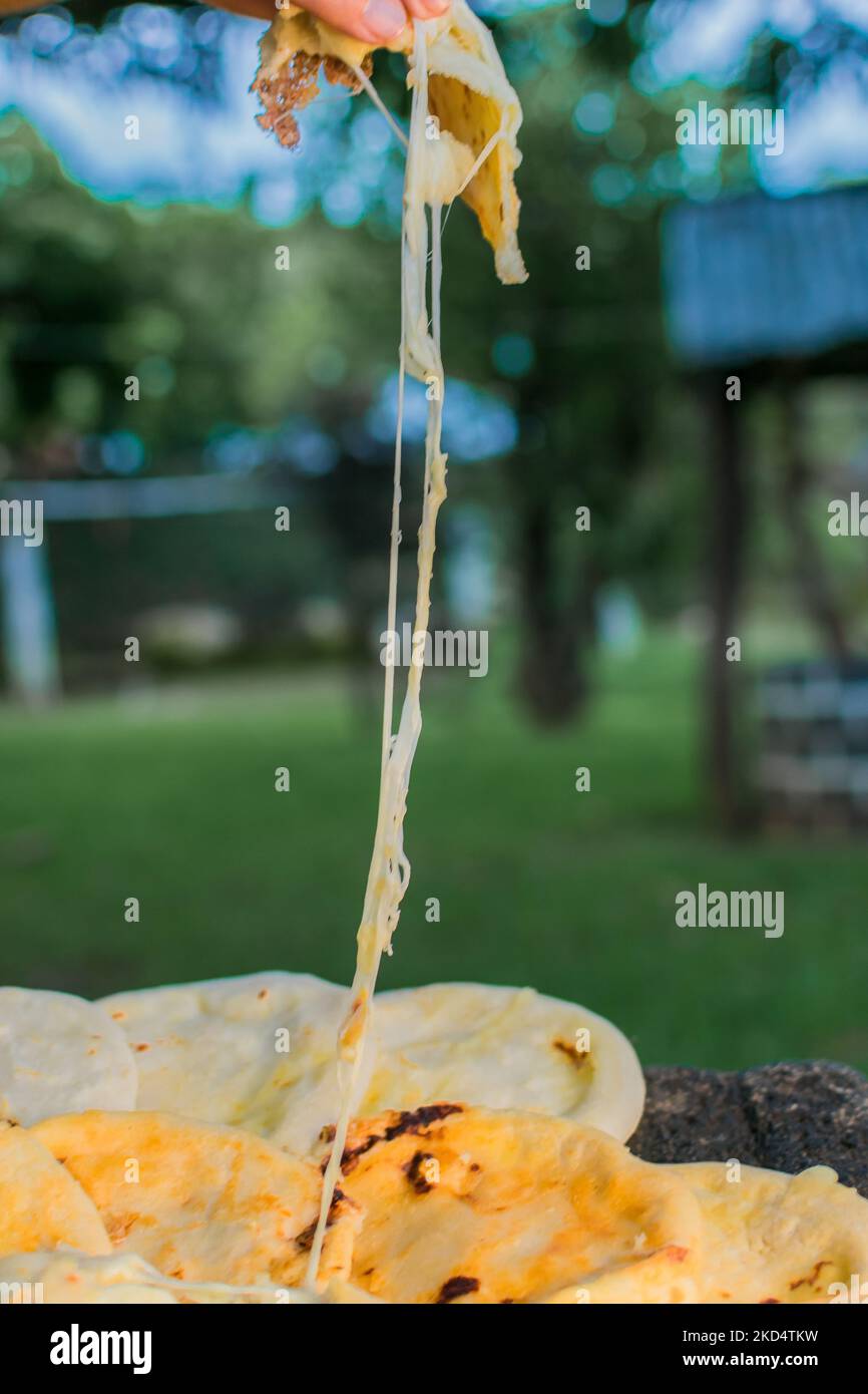 typical Salvadoran dish, cheese pupusas with cabbage and tomato sauce ...
