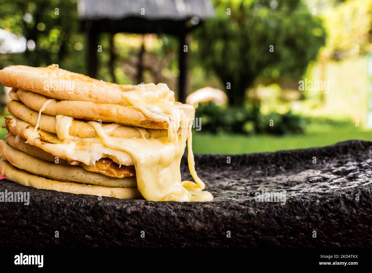 typical Salvadoran dish, cheese pupusas with cabbage and tomato sauce ...