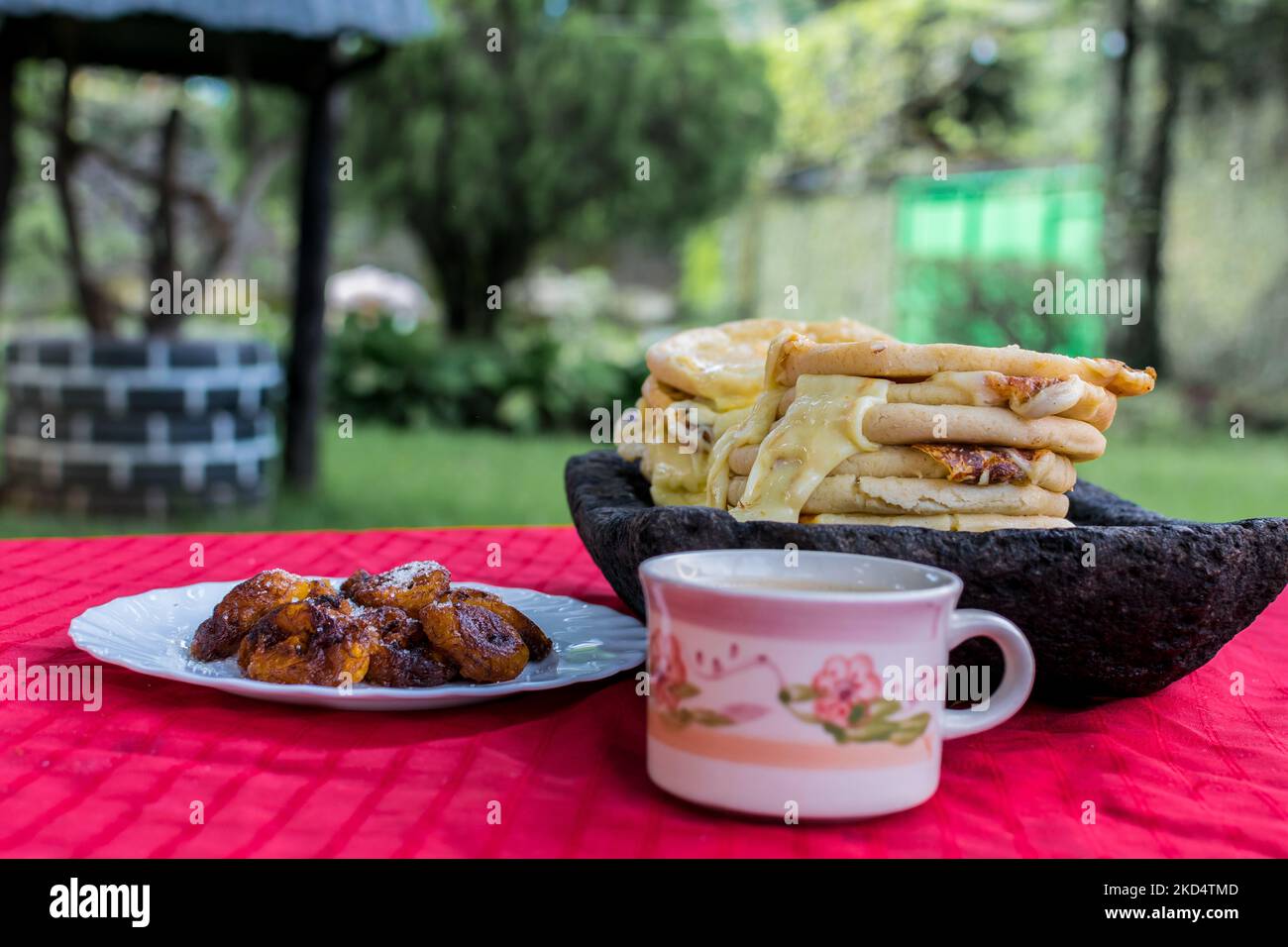 typical Salvadoran dish, cheese pupusas with cabbage and tomato sauce ...