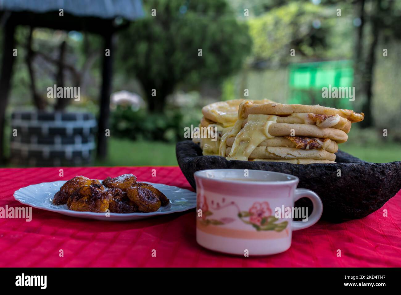 typical Salvadoran dish, cheese pupusas with cabbage and tomato sauce ...