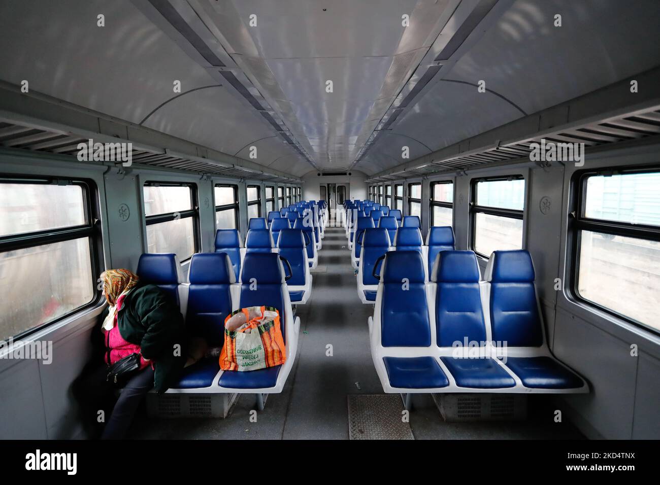 An elderly Ukrainian woman on a train connecting to Ukraine, as many ...