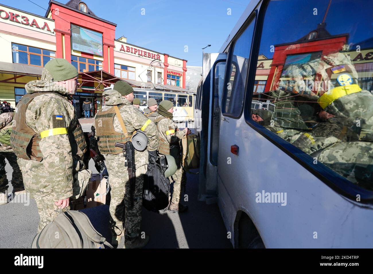 Ukrainian soldiers board a shuttle for post rotation, as floods of ...