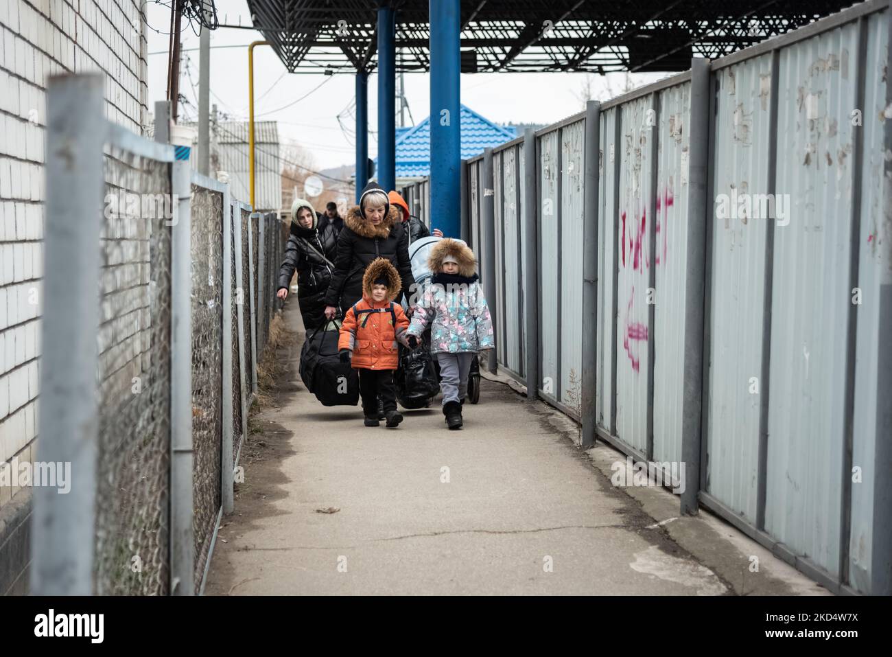 An Ukrainian family of five is seen crossing the border and reach the ...