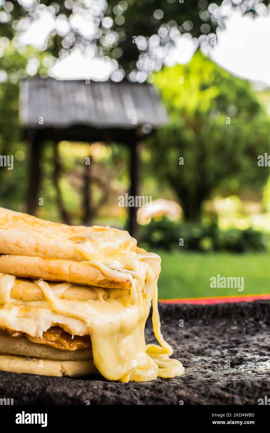 typical Salvadoran dish, cheese pupusas with cabbage and tomato sauce ...
