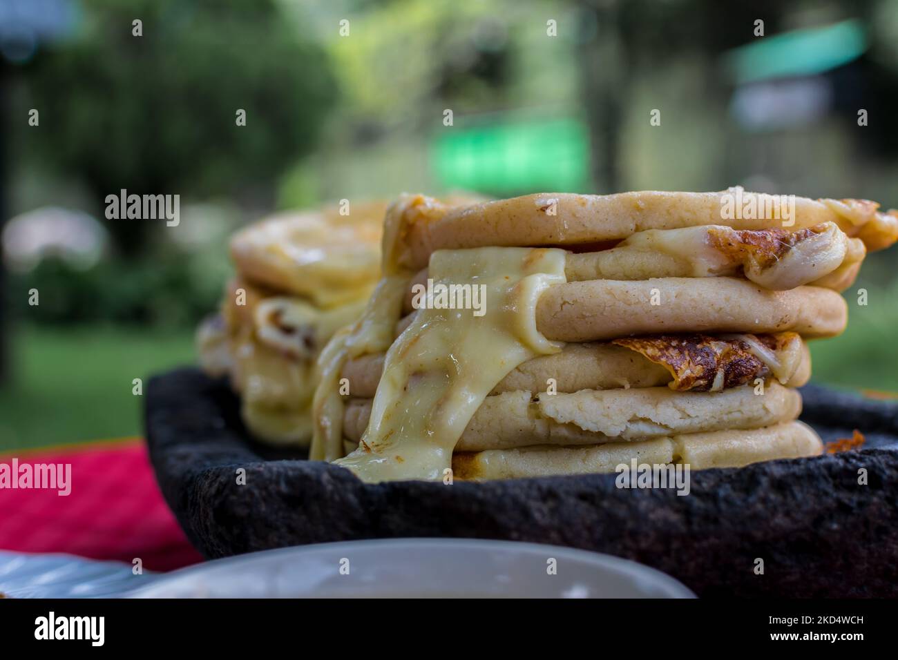 typical Salvadoran dish, cheese pupusas with cabbage and tomato sauce ...