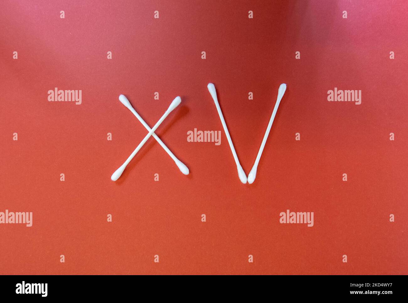 number fifteen (15) in roman numerals with clean white cotton buds ...