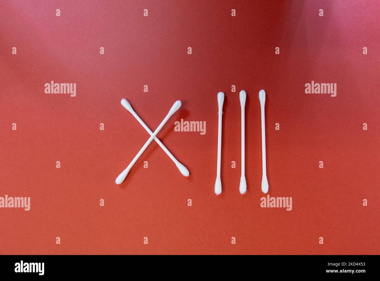 number thirteen (13) in roman numerals with clean white cotton buds ...