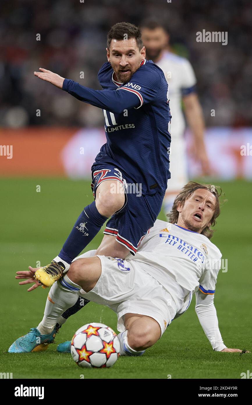 Leo Messi of PSG and Luka Modric of Real Madrid compete for the ball ...
