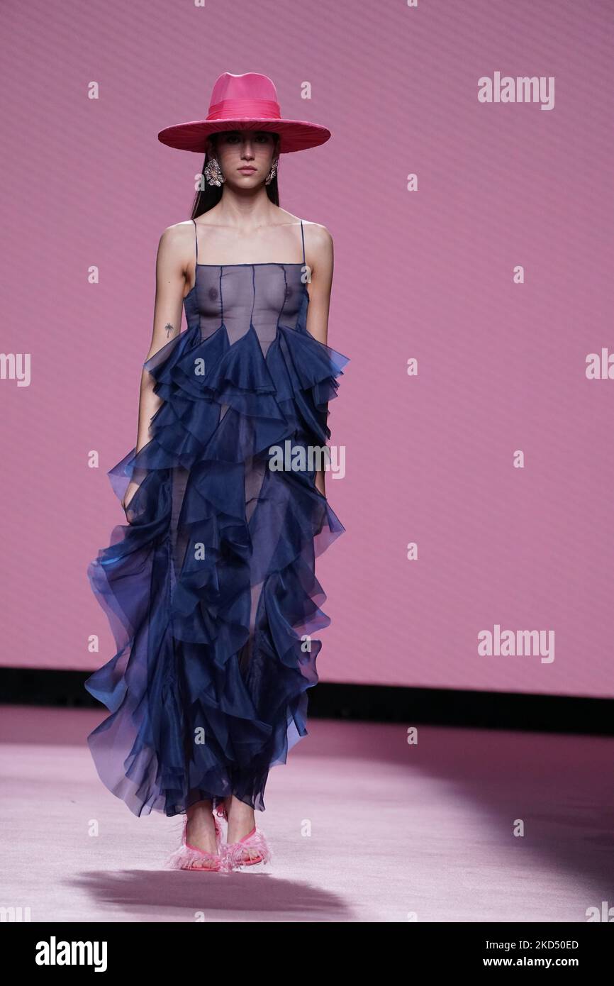 Model walks the runway at the Redondo Brand fashion show during ...