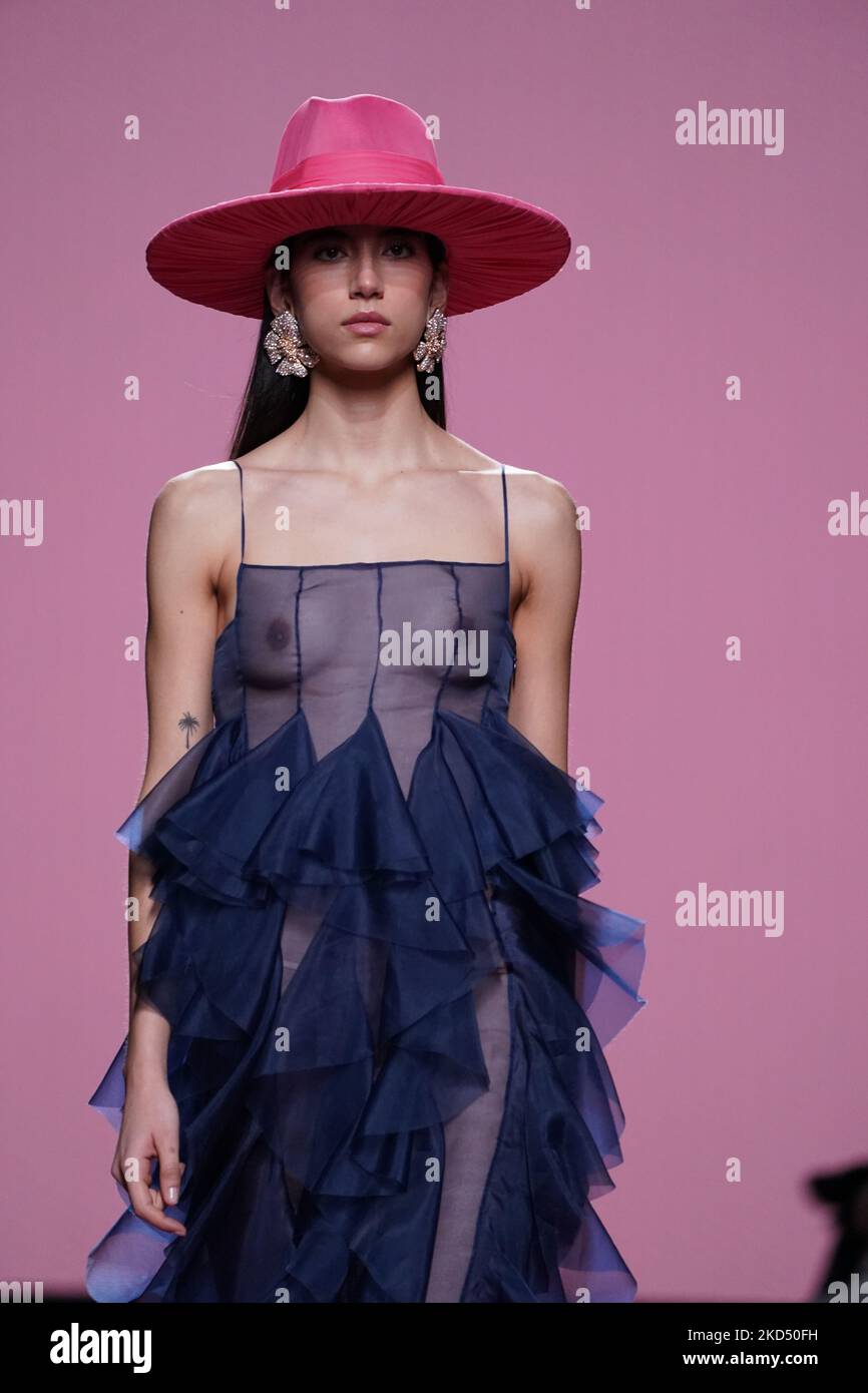 Model walks the runway at the Redondo Brand fashion show during ...