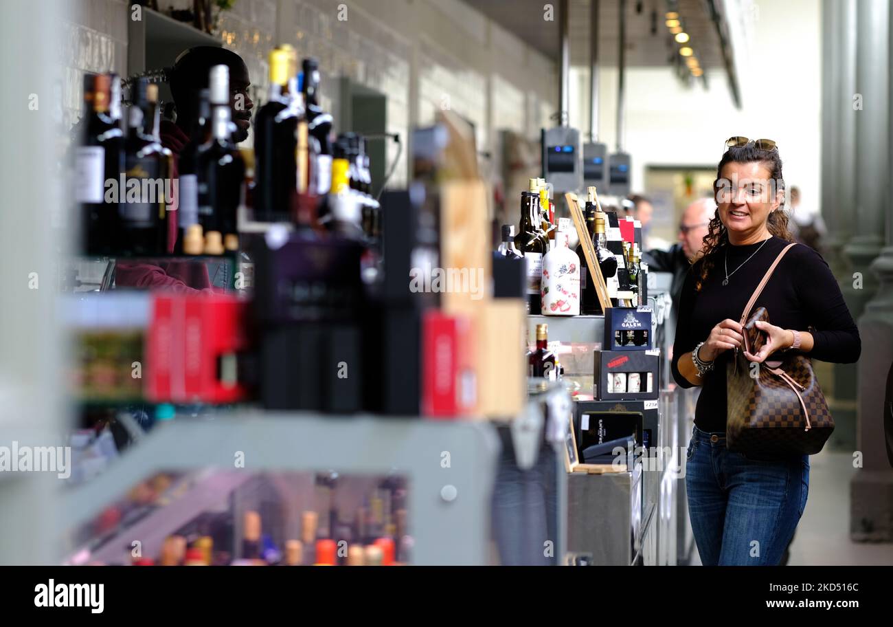 Porto Portugal - a female customer shops for Port at the recently ...