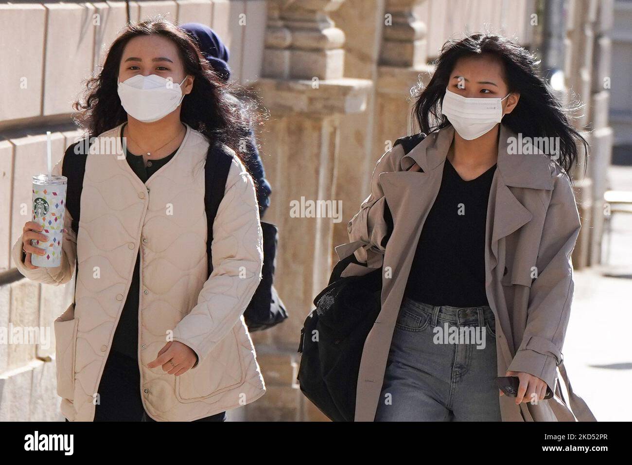 People wearing face maks as they walk in krakow city centre on 13 march ...