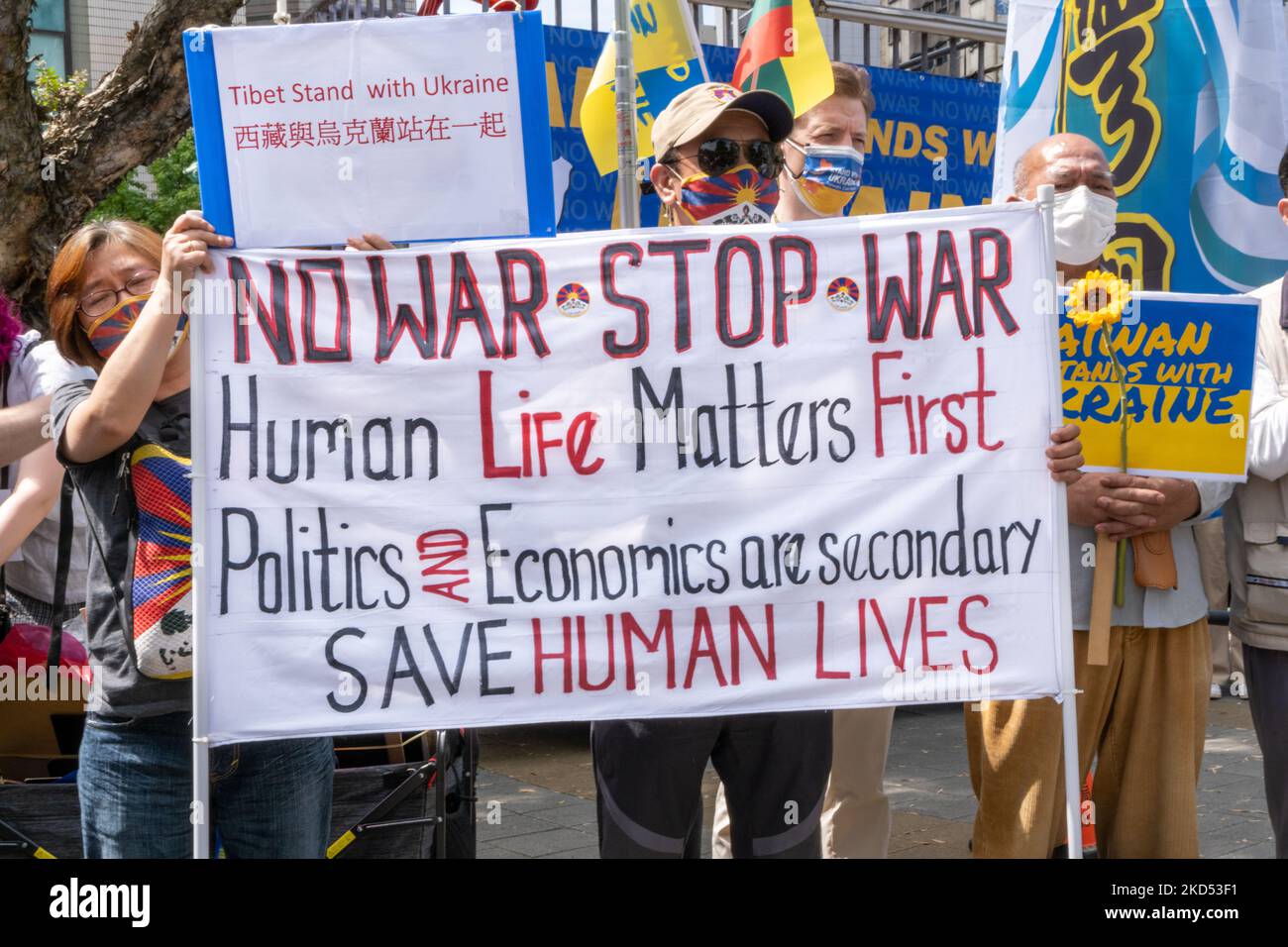 Big White banner reading NO WAR STOP WAR, HUMAN LIFE MATTERS FIRST ...