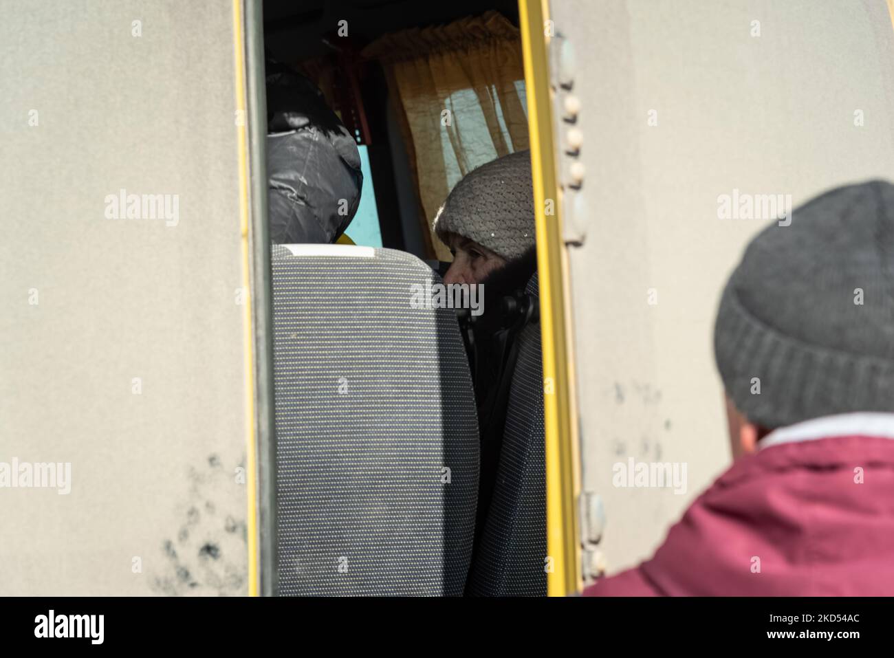 An Ukrainian woman is seen inside a minivan headed to Chisinau, Moldova ...
