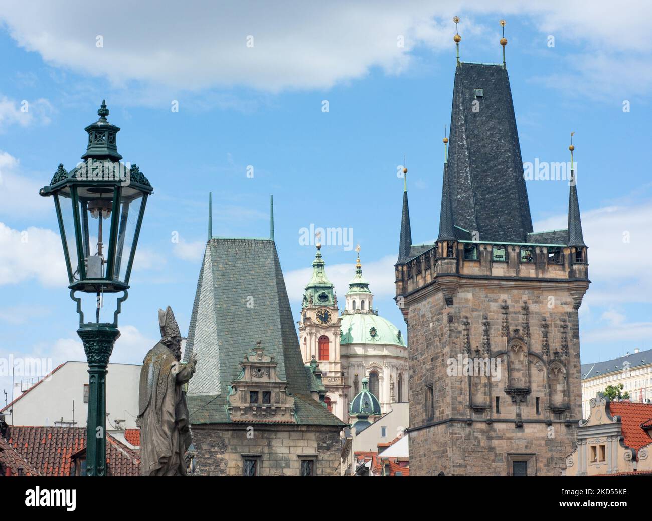Buildings with red tile roofs. Spires of churches. Old Town Square ...